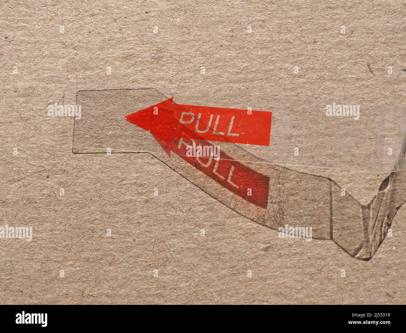 pull label with red arrow indicating direction Stock Photo - Alamy