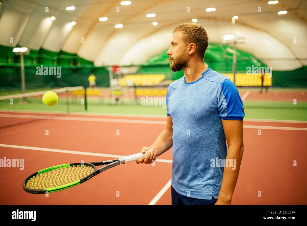Trainer teaching to play tennis hi-res stock photography and images - Alamy