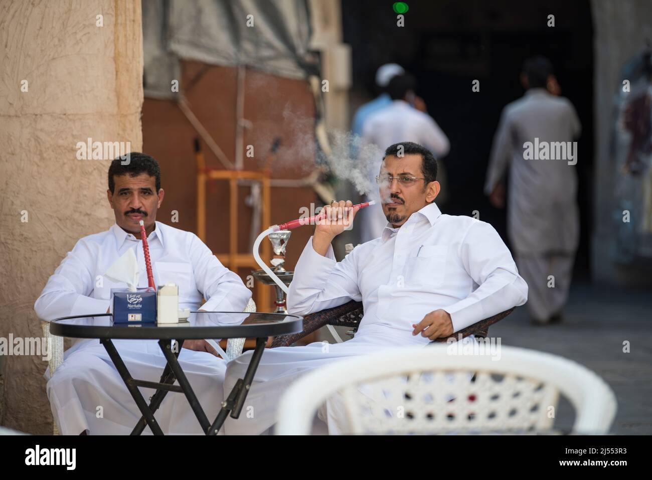Doha,Qatar - April 15,2022 : Qatari locals in traditional attire hang ...