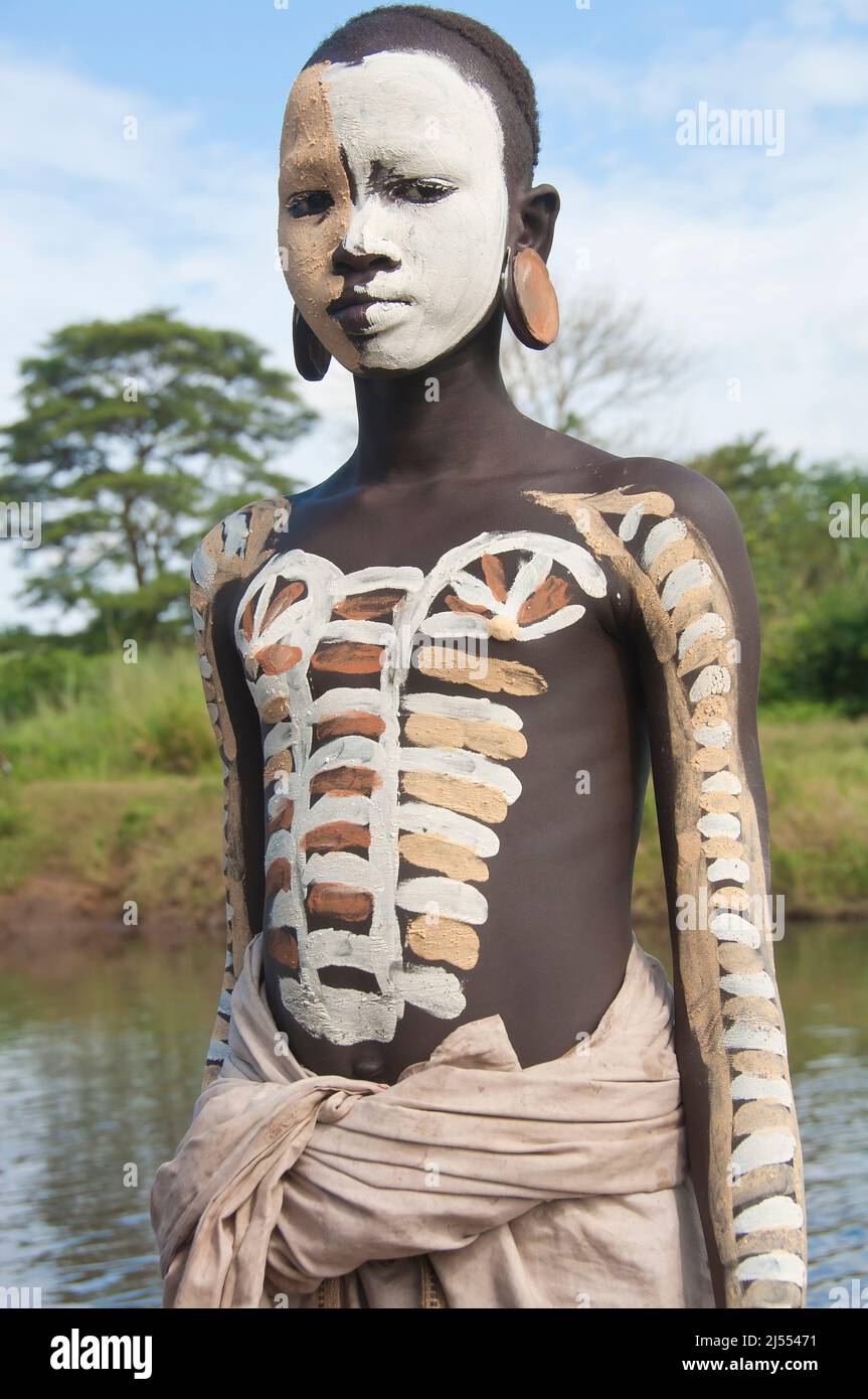 Surma girl with body paintings and ear plates, Kibish, Omo River Valley ...