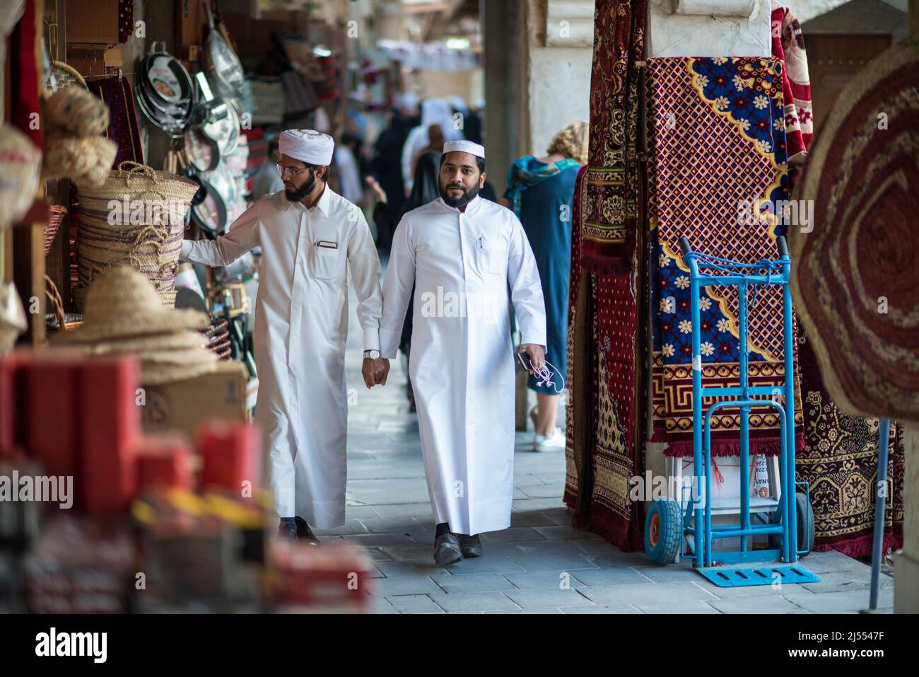Doha,Qatar - April 15,2022 : Qatari locals in traditional attire hang ...