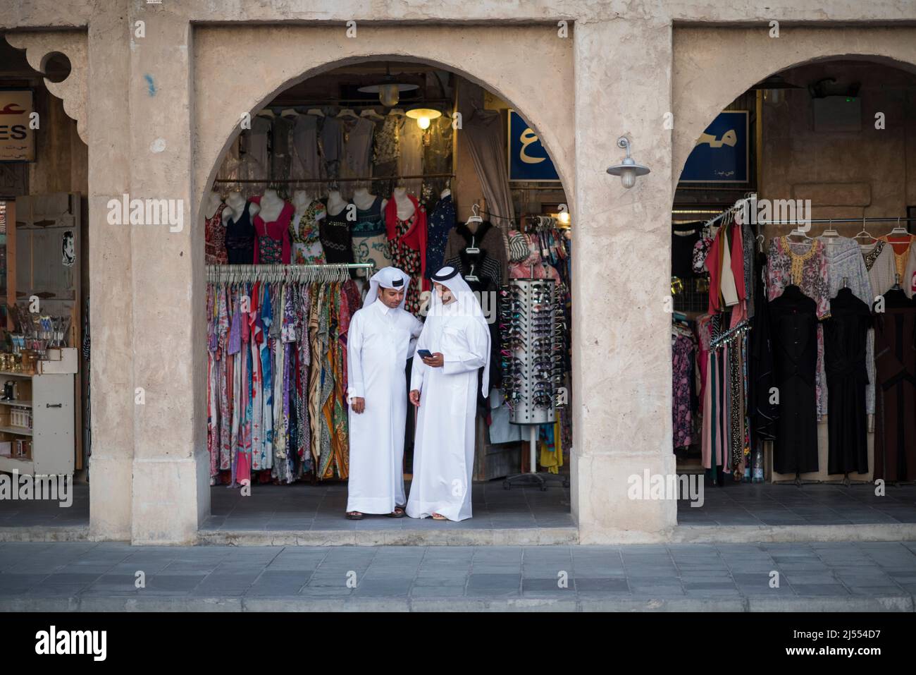 Doha,Qatar - April 15,2022 : Qatari locals in traditional attire hang ...