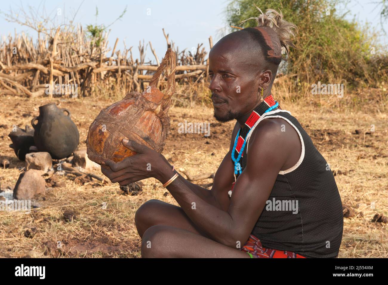 Hamar man drinking sorghum beer from a calabash, Omo river valley ...
