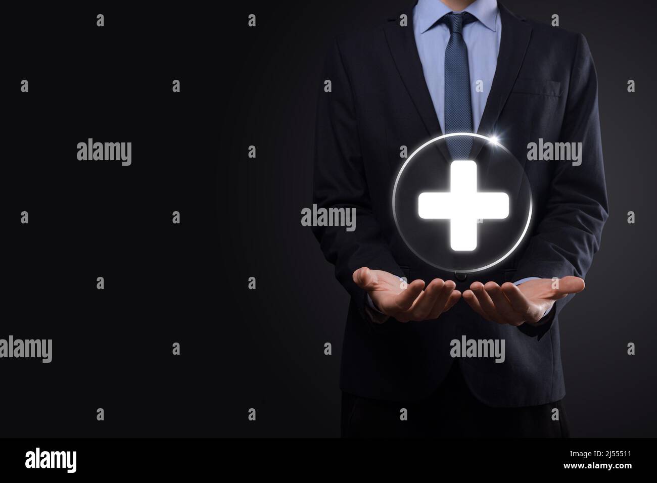 Businessman hold virtual plus medical network connection icons. Covid ...