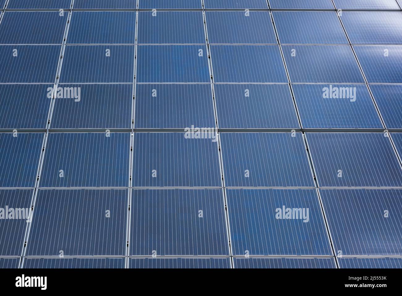 solar panels on the wall of a multi-storey building. Renewable solar ...