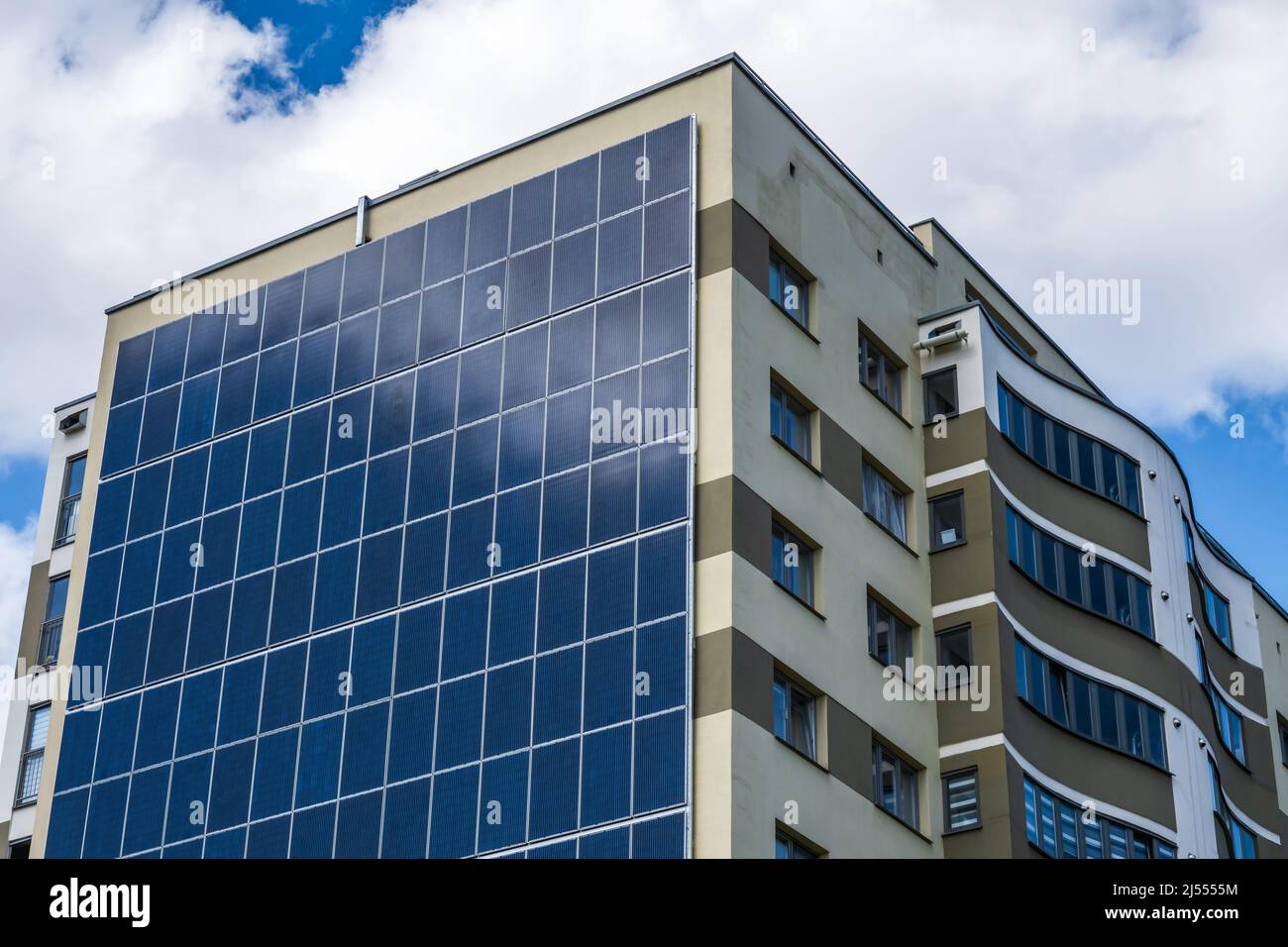 solar panels on the wall of a multi-storey building. Renewable solar ...