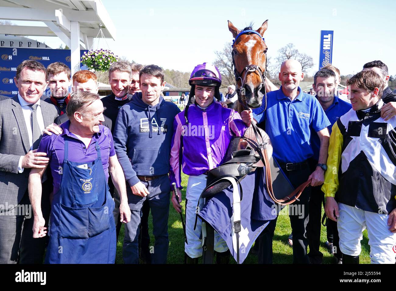 Jockey Brian Hughes (centre) celebrates his 200th season win with horse ...