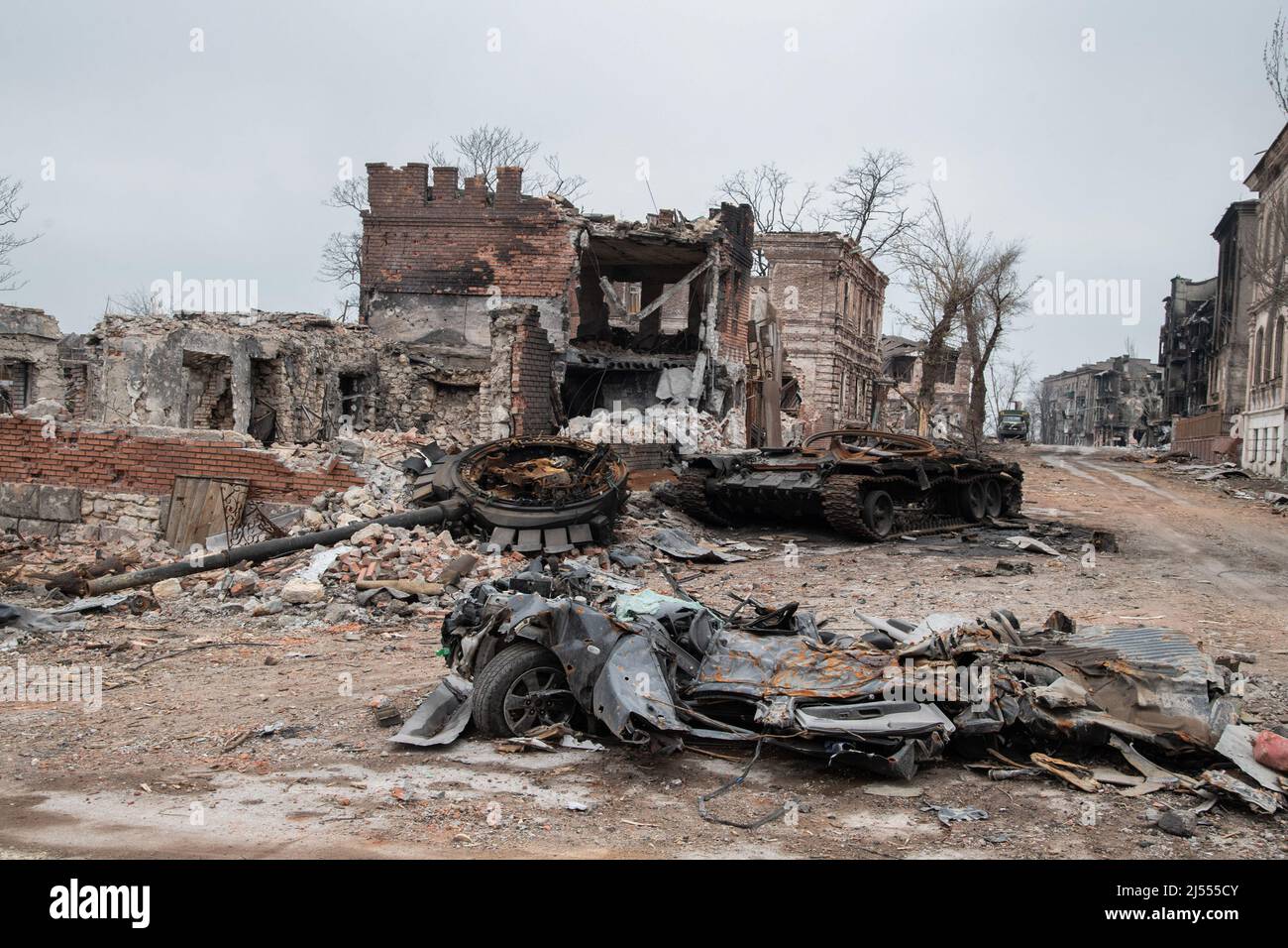 Mariupol, Ukraine. 12th Apr, 2022. A flattened car and destroyed tank ...