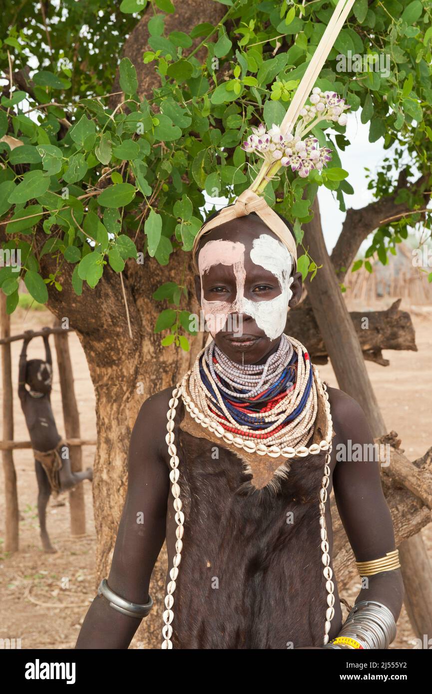 Portrait of a Karo woman with face paintings and lots of colorful ...