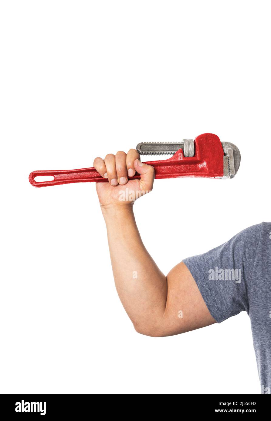 Arm of a man showing muscle gripping a socket wrench on a white ...