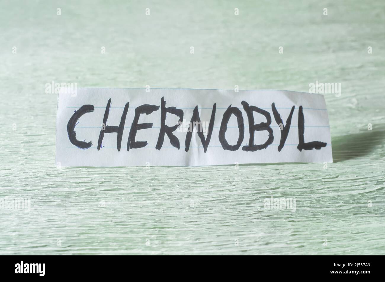 Chernobyl,word written on a paper cut and placed in a light green place ...
