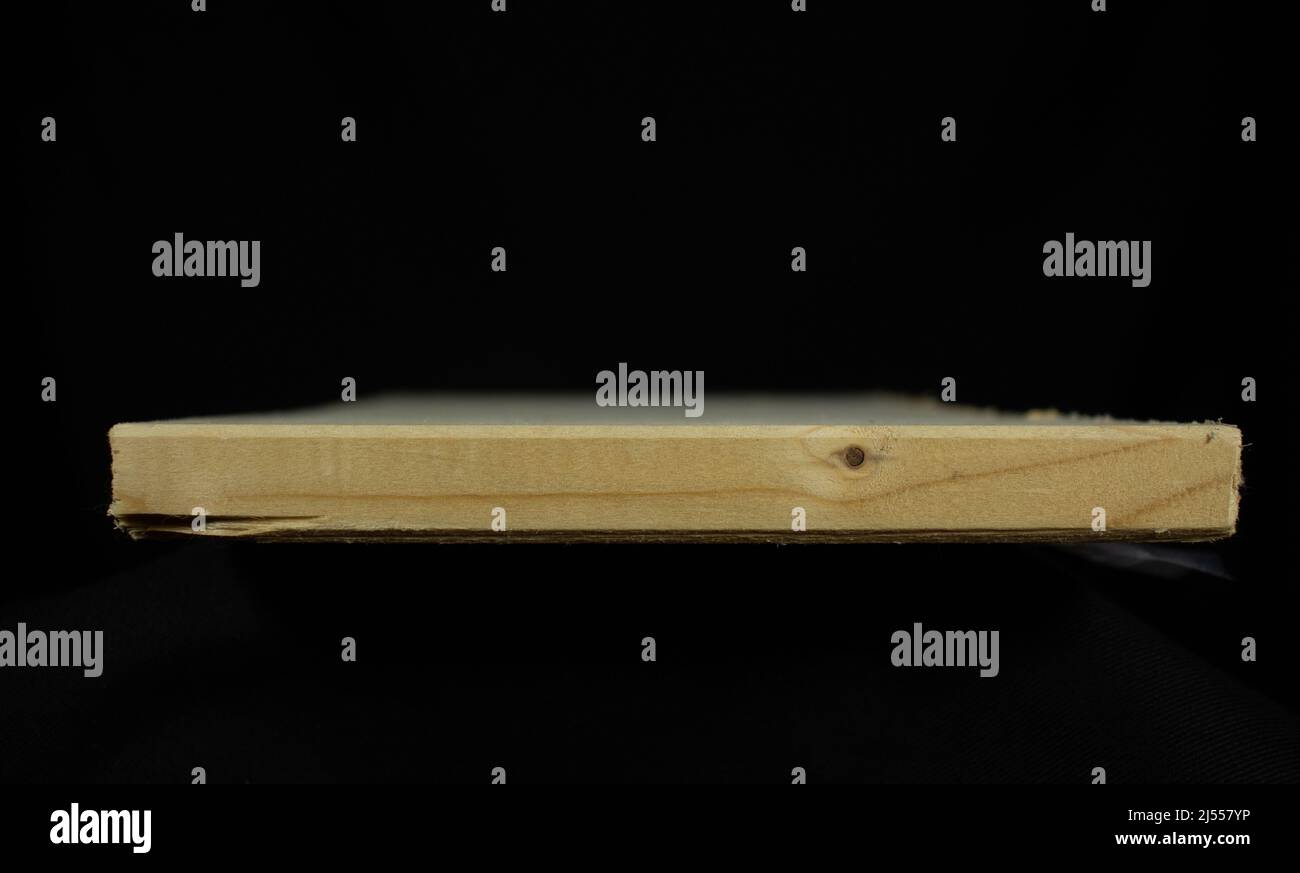 edge cut piece of soft pine isolated on a black background Stock Photo ...