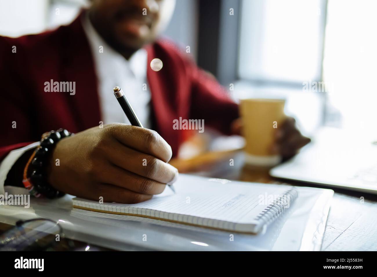 closeup of hands right handed african manager write on document Stock ...