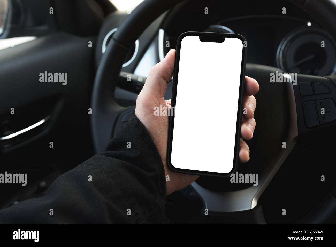 Male driver using smartphone in the car, blank white screen of mobile ...