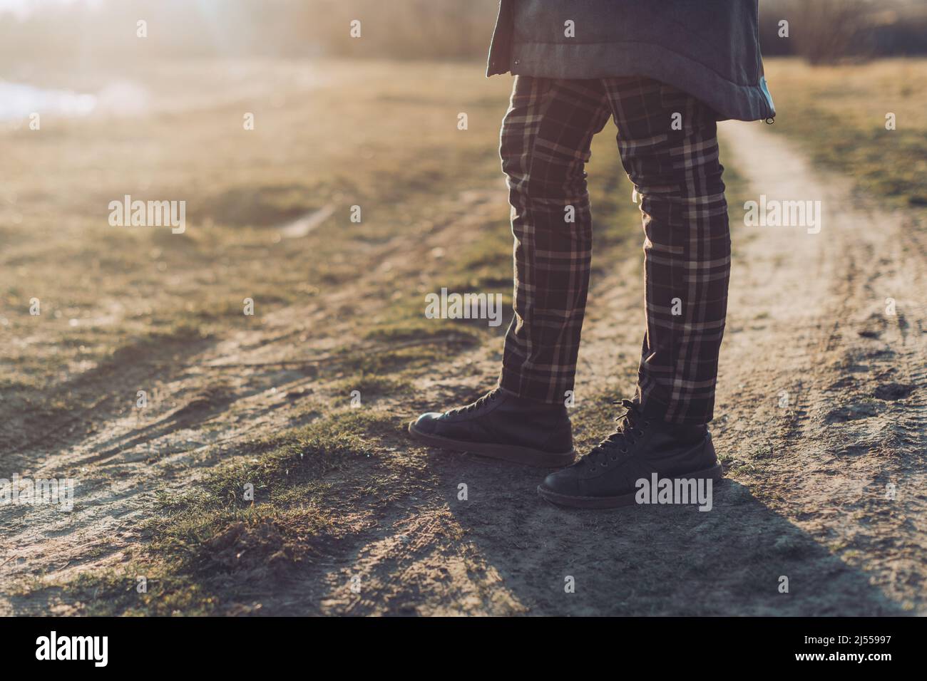 Female person wearing punk rocky style clothes outdoors, standing on ...