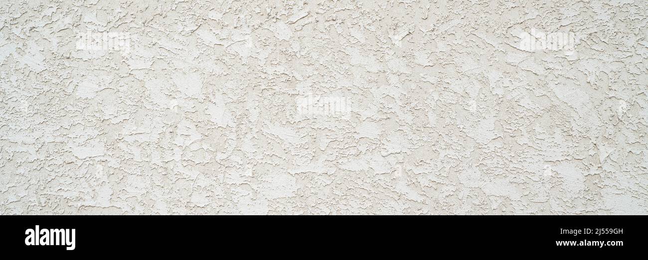rough stucco texture background on an exterior building wall, panoramic ...