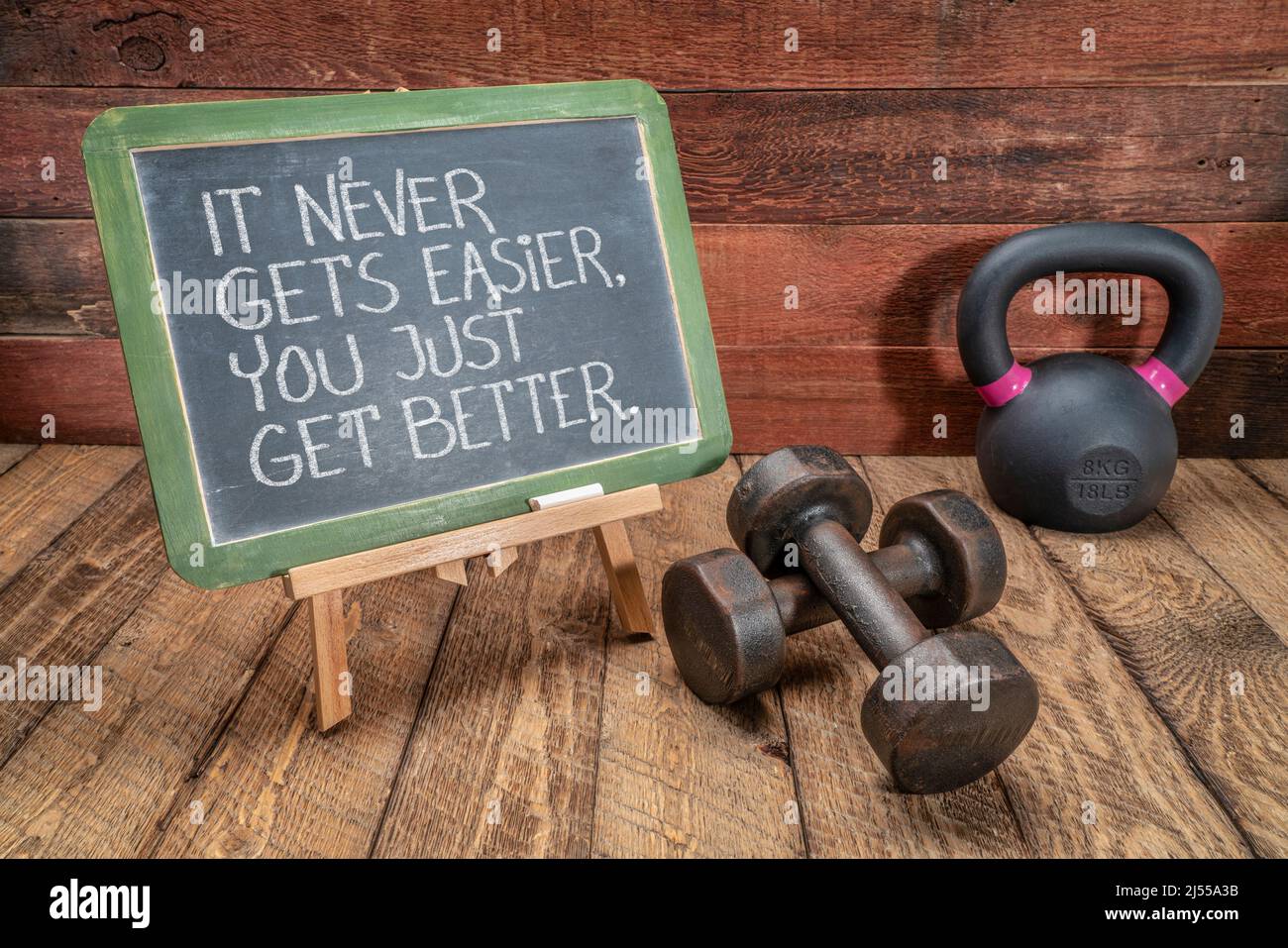 it never gets easier, you just get better - inspirational slogan on a ...