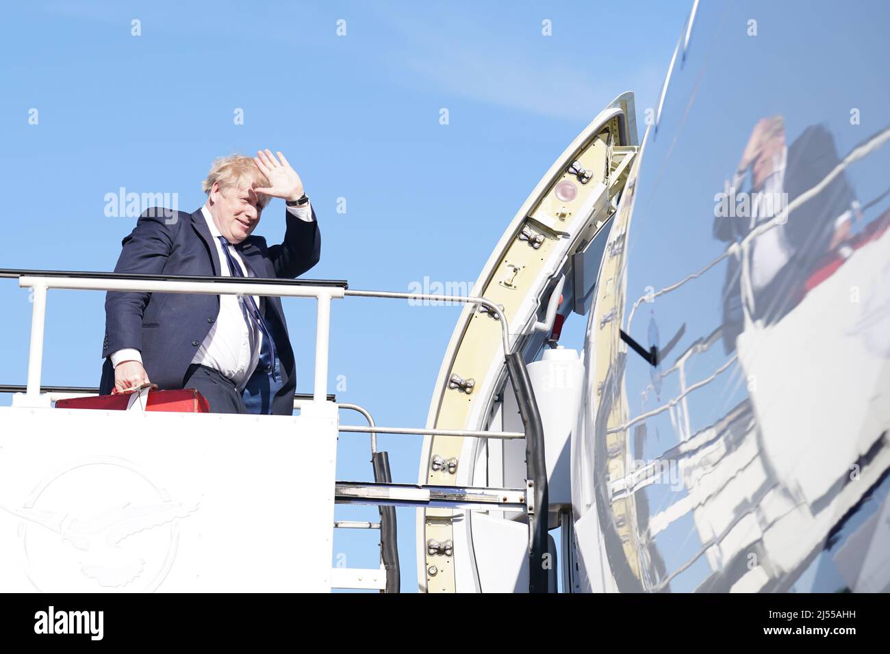 Prime Minister Boris Johnson boards a plane at Stansted Airport as he ...