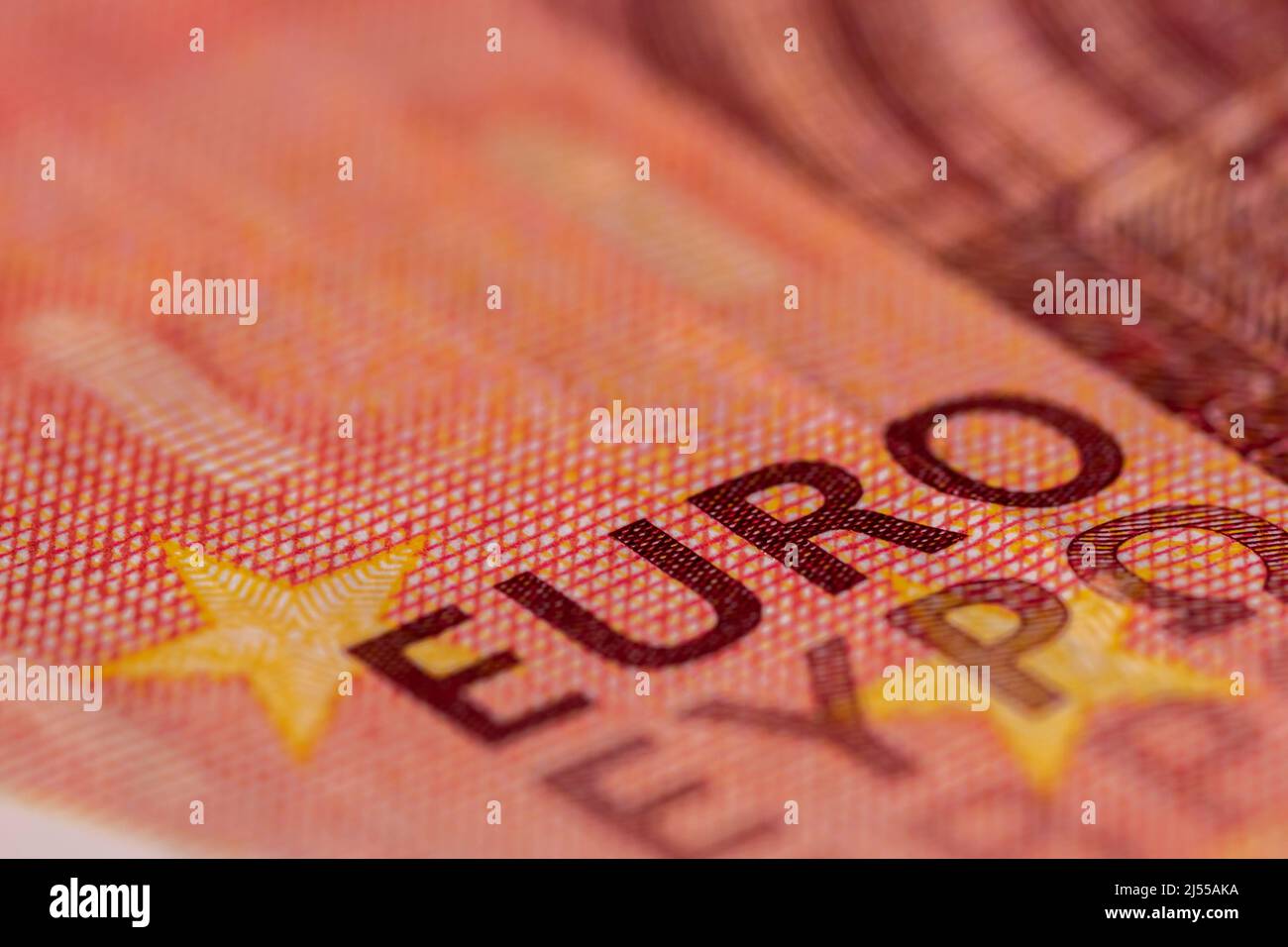 Close-up shot of Euro sign and text present on a banknote Stock Photo ...