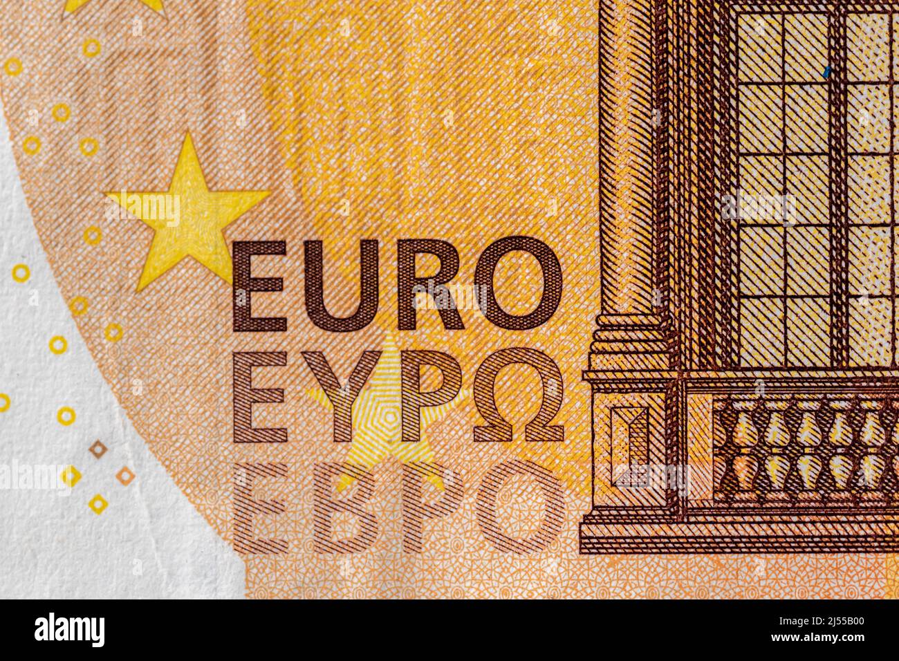 Close-up shot of Euro sign and text present on a banknote Stock Photo ...
