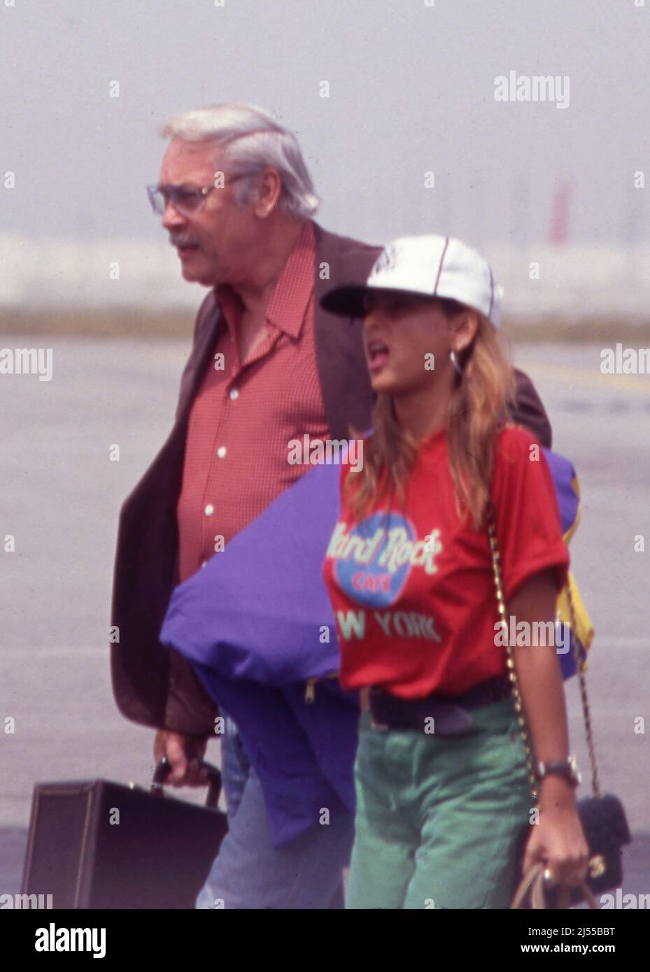 Jerry Buss and Jeanie Buss seen arriving at LAX Airport April 1992 ...
