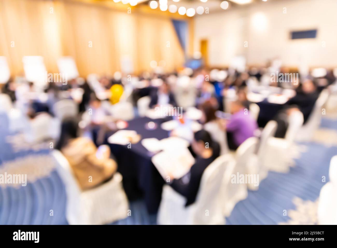 Abstract blur group of people in business training workshop ...