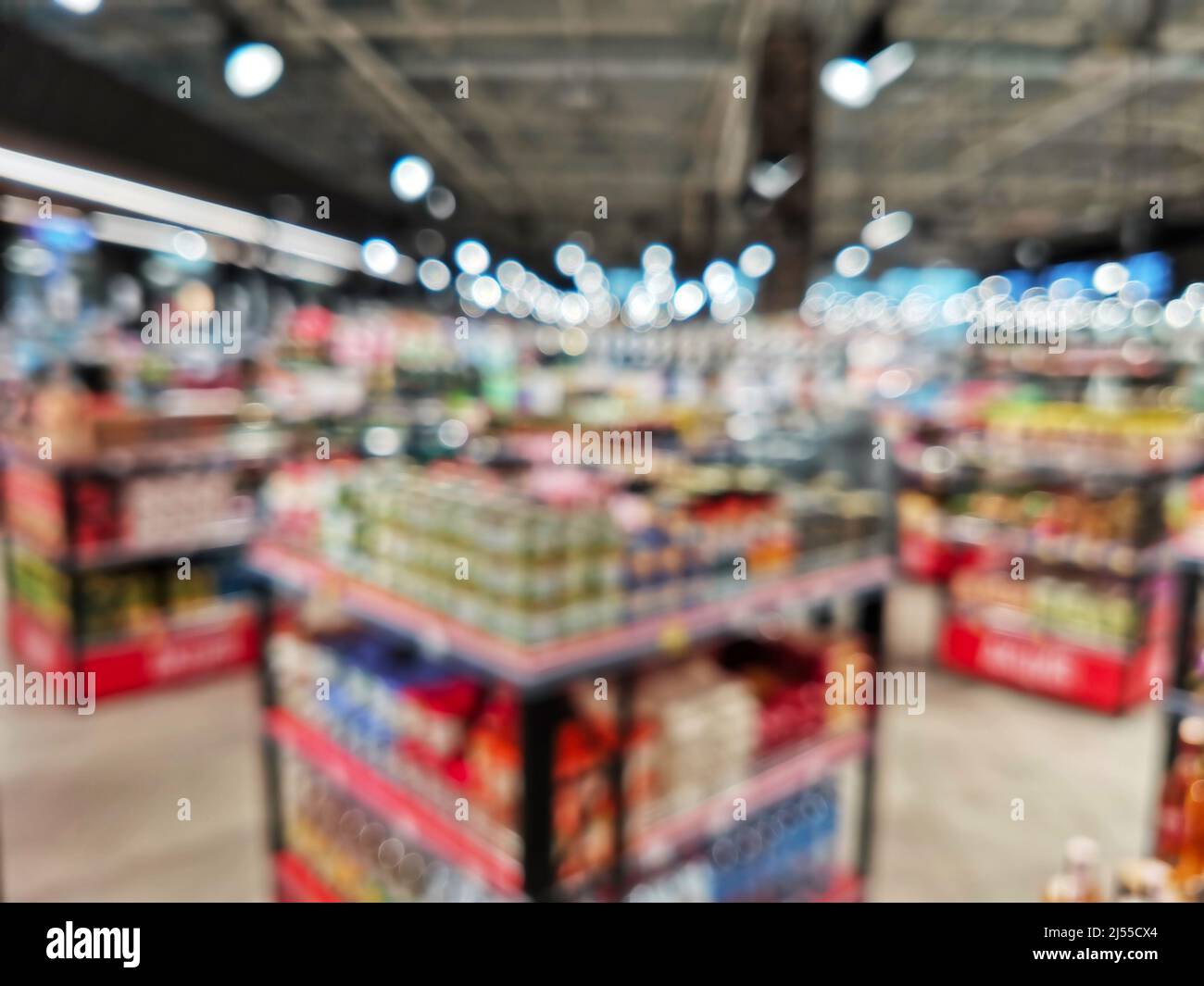 Grocery store blur bokeh background - shoppers at grocery store with ...
