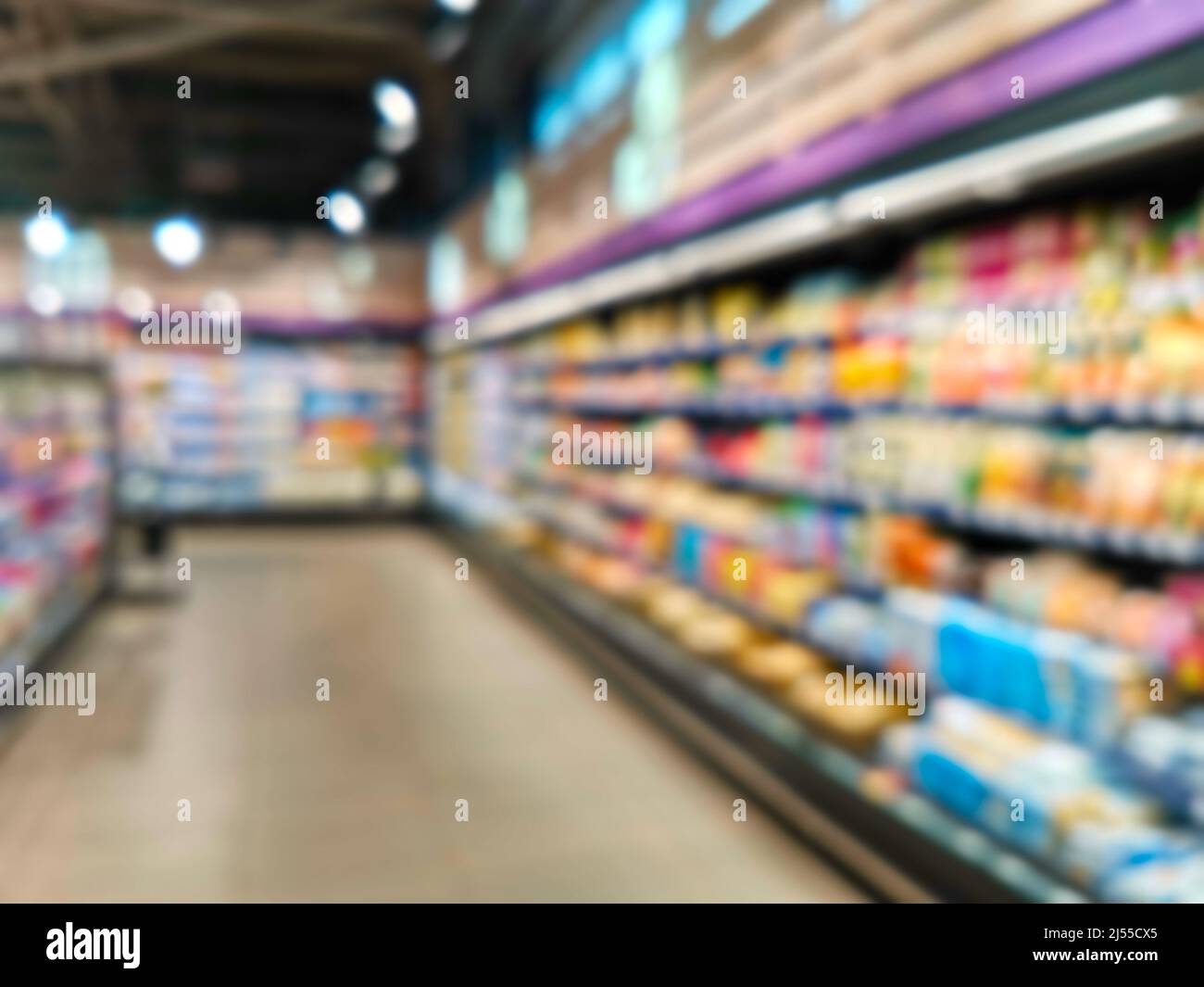Grocery store blur bokeh background - shoppers at grocery store with ...