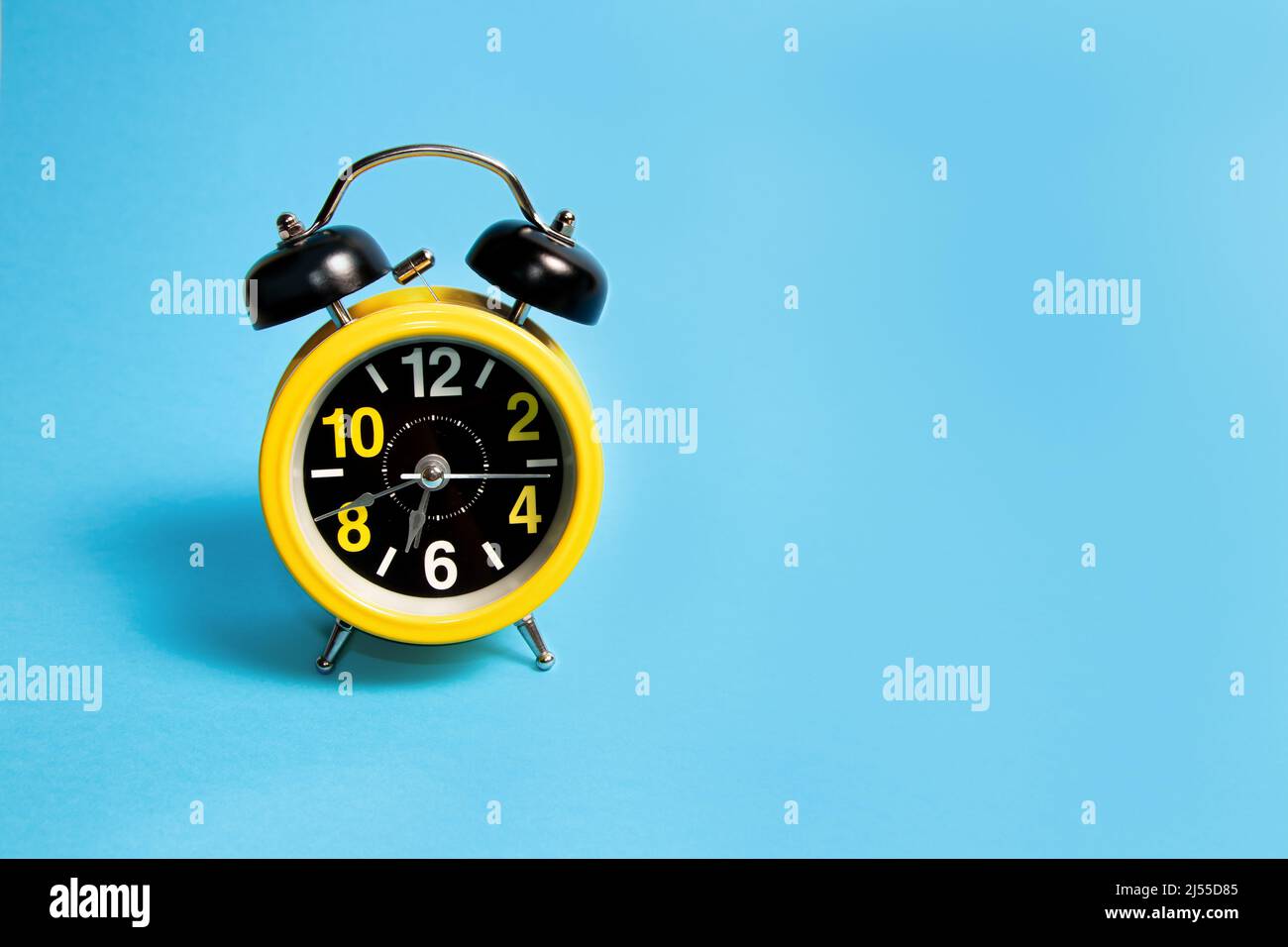 Yellow background alarm clock hi-res stock photography and images - Alamy
