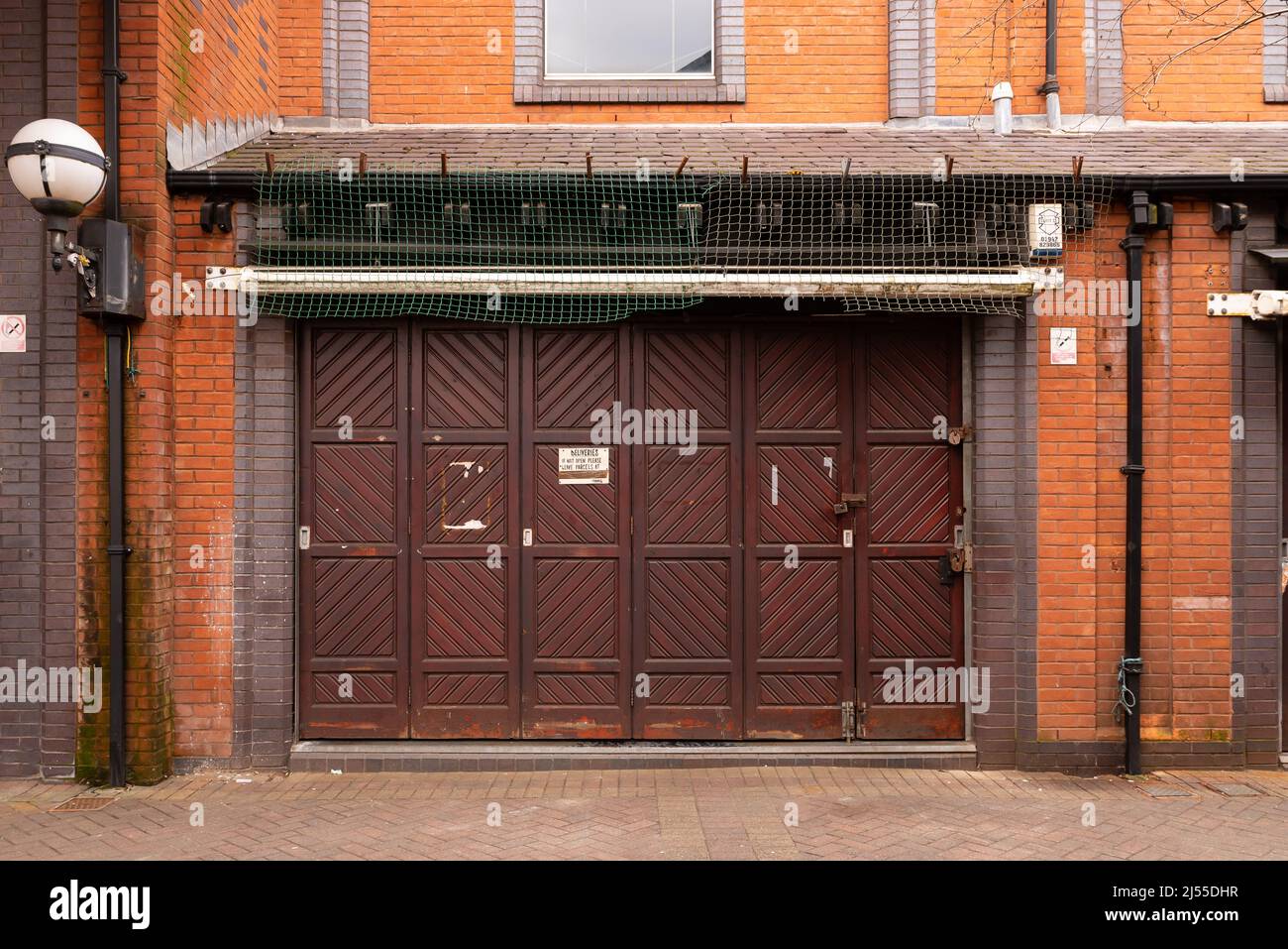 Closed shop doors in English town center Stock Photo - Alamy