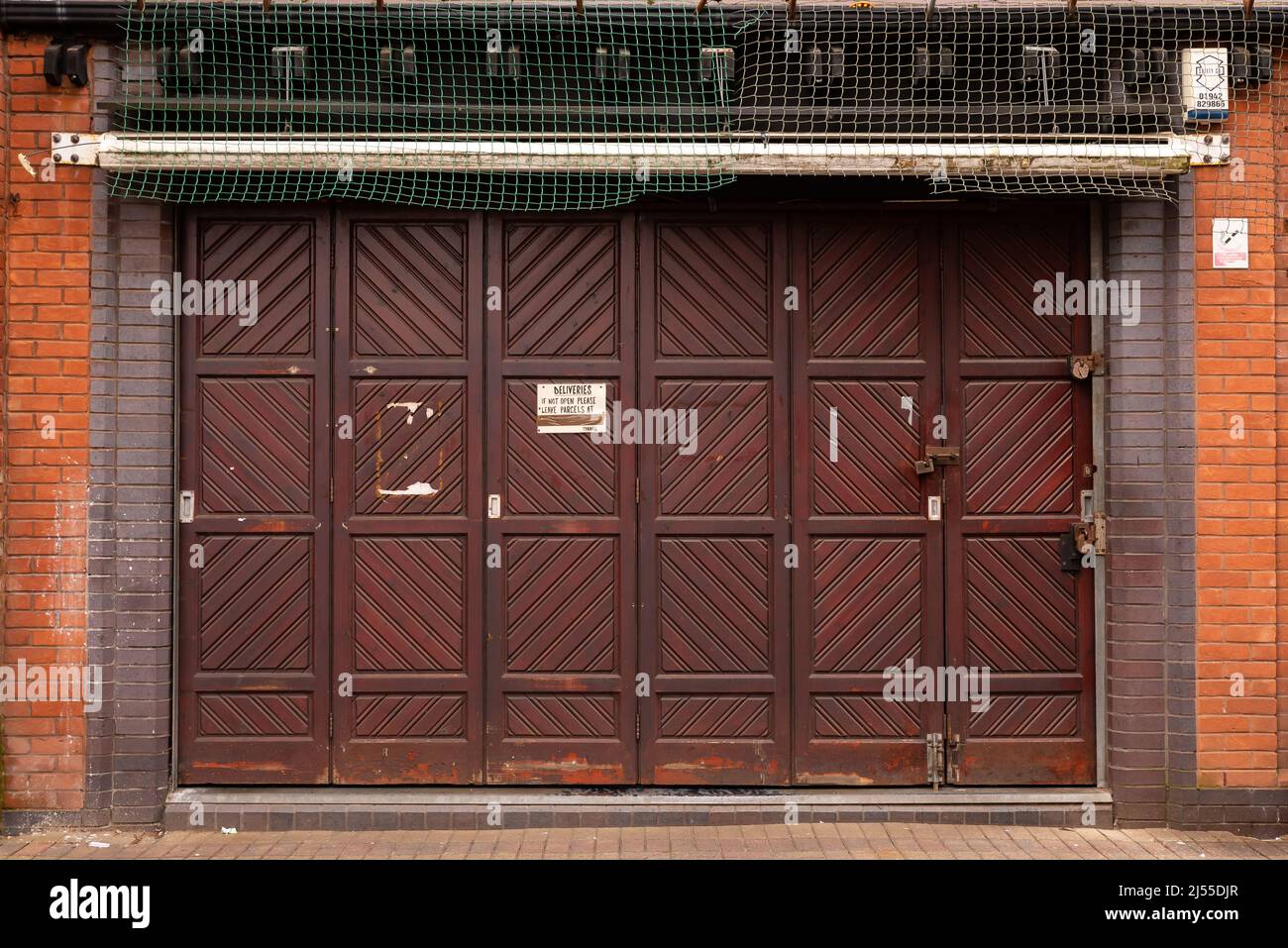 Closed shop doors in English town center Stock Photo - Alamy