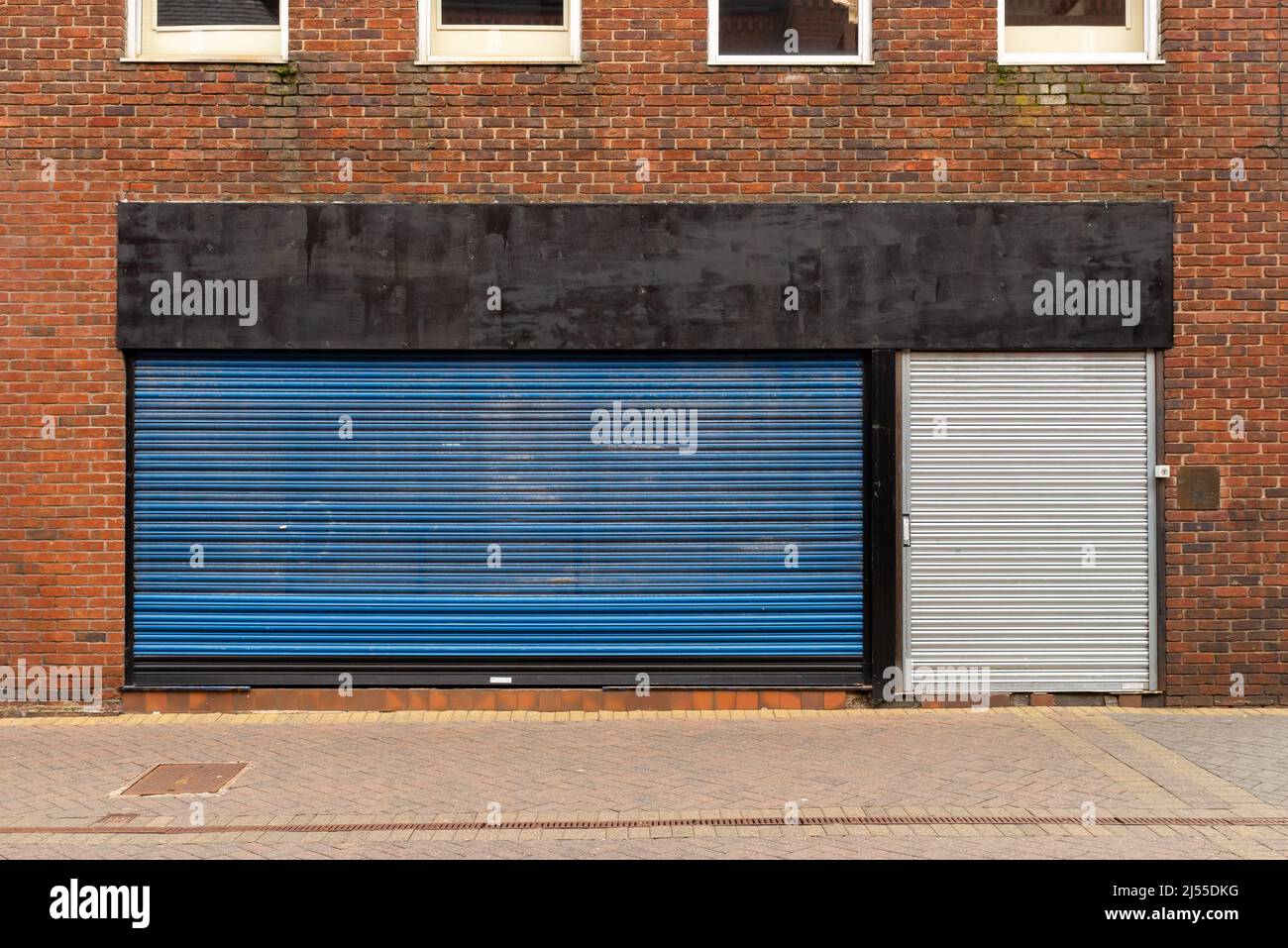 Closed shop doors in English town center Stock Photo - Alamy