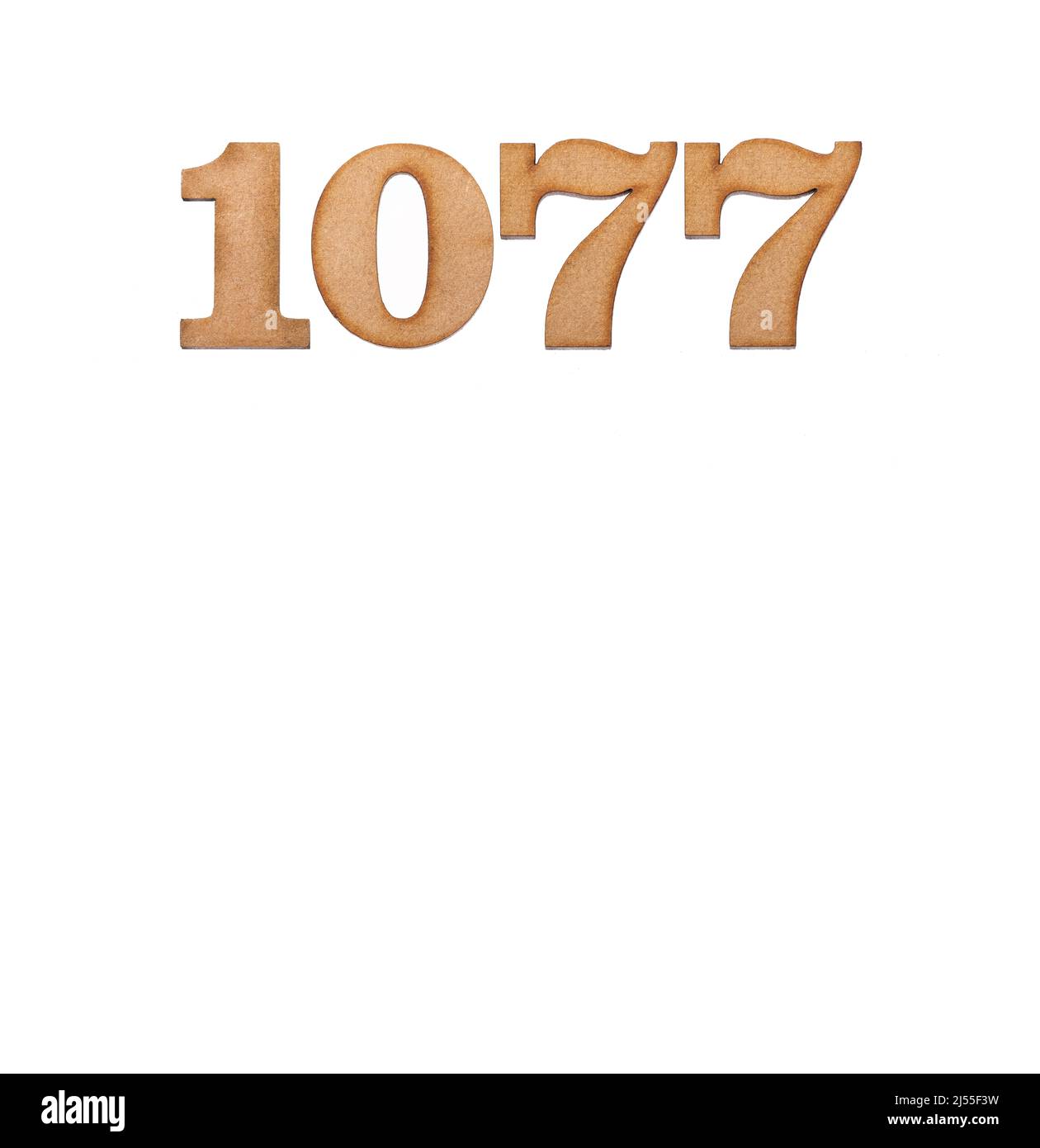Number 1077 in wood, isolated on white background Stock Photo - Alamy