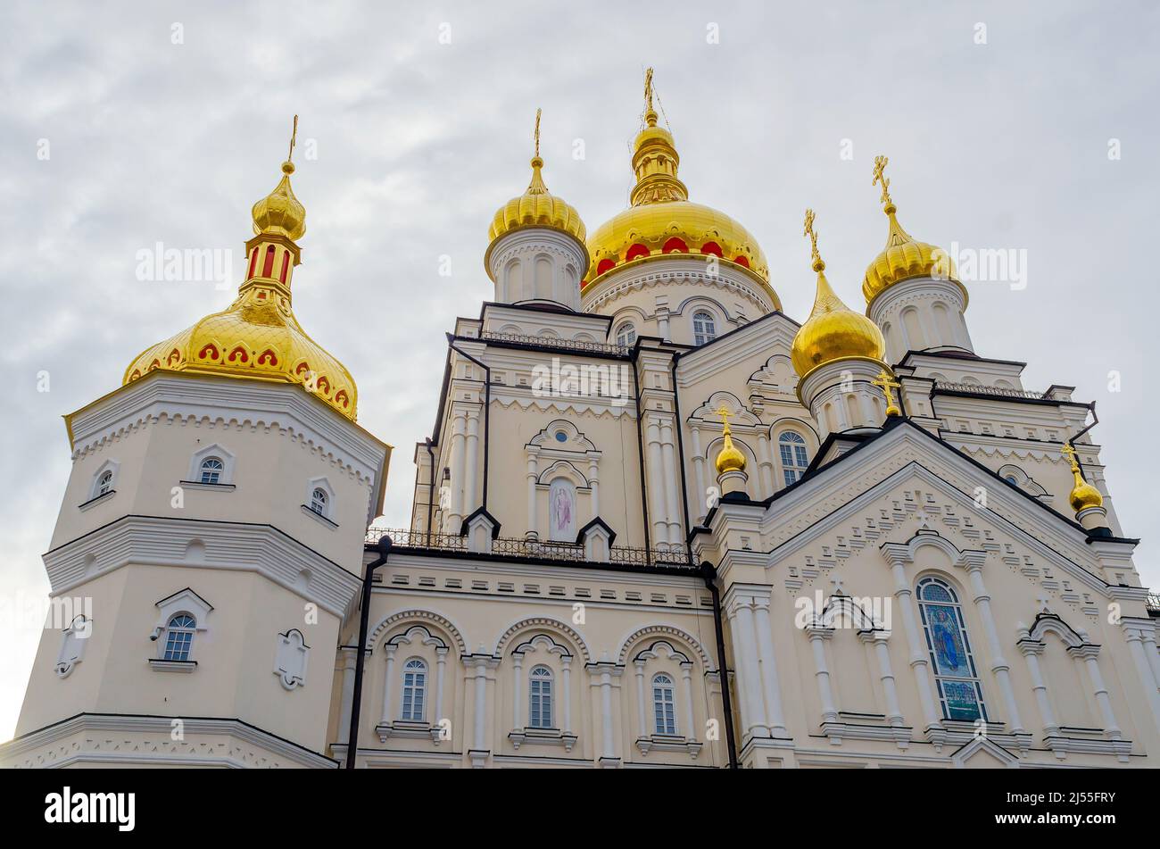Orthodox Christian cathedral with golden domes. Religious buildings. Holy Dormition Pochaiv ...