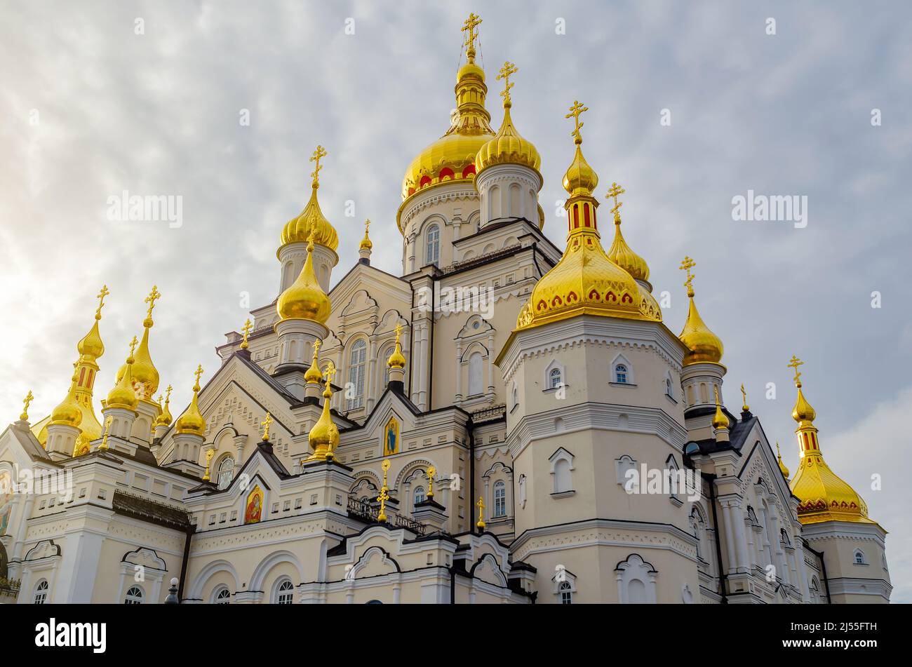 Orthodox Christian cathedral with golden domes. Religious buildings. Holy Dormition Pochaiv ...