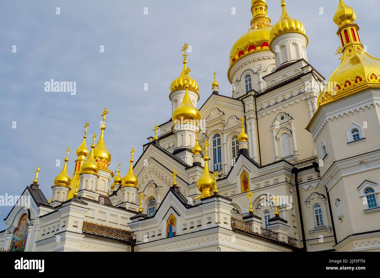 Orthodox Christian cathedral with golden domes. Religious buildings. Side view. Holy Dormition ...