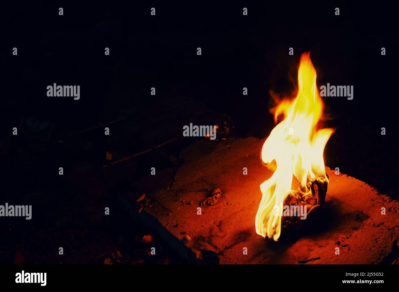 Bright fire torch on dark background. White yellow red flame Stock ...