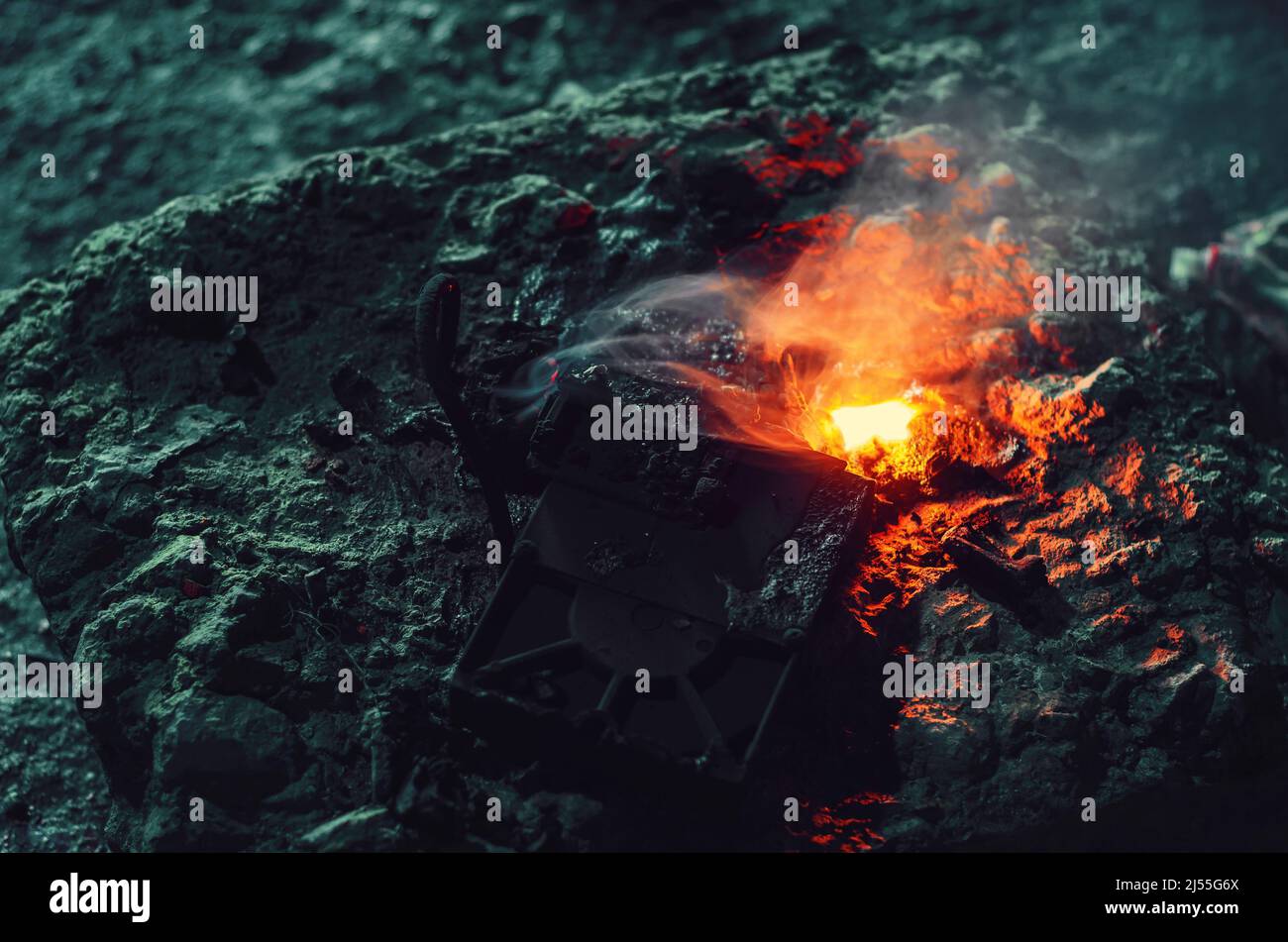 Extinguishing hearth. Burnt objects. Ashes of hearth. Weak fire on ...