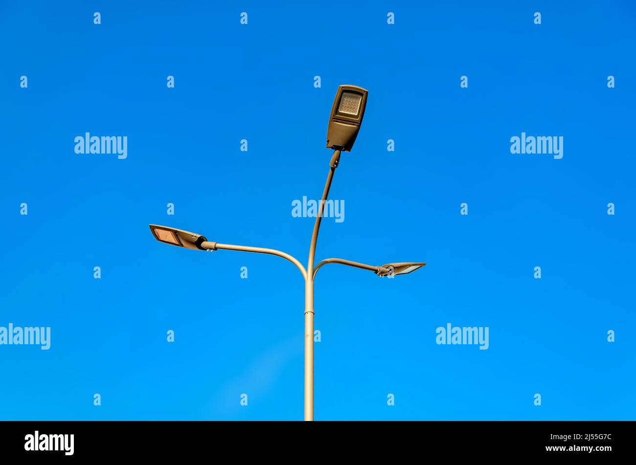 Modern street lighting. Lantern with three LED lamps Stock Photo - Alamy