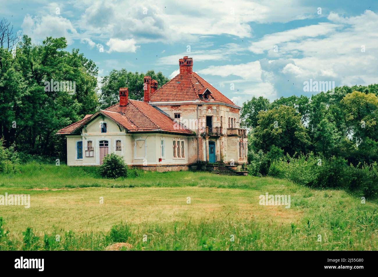 Summer landscape with house and green trees. Old abandoned building ...