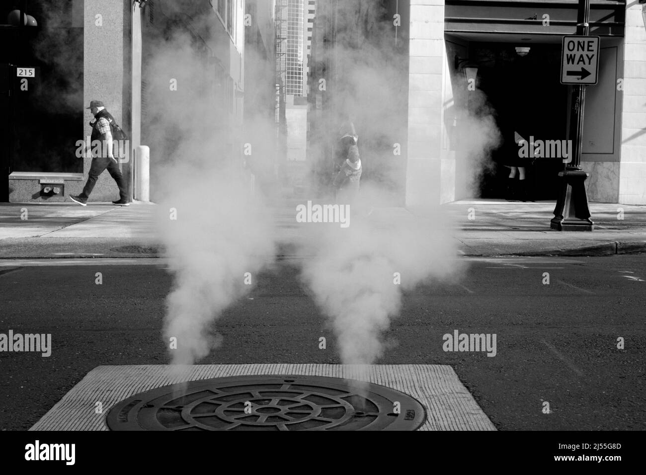 Seattle, USA. 14 Mar, 2022. A monochromatic image of a smoking manhole ...