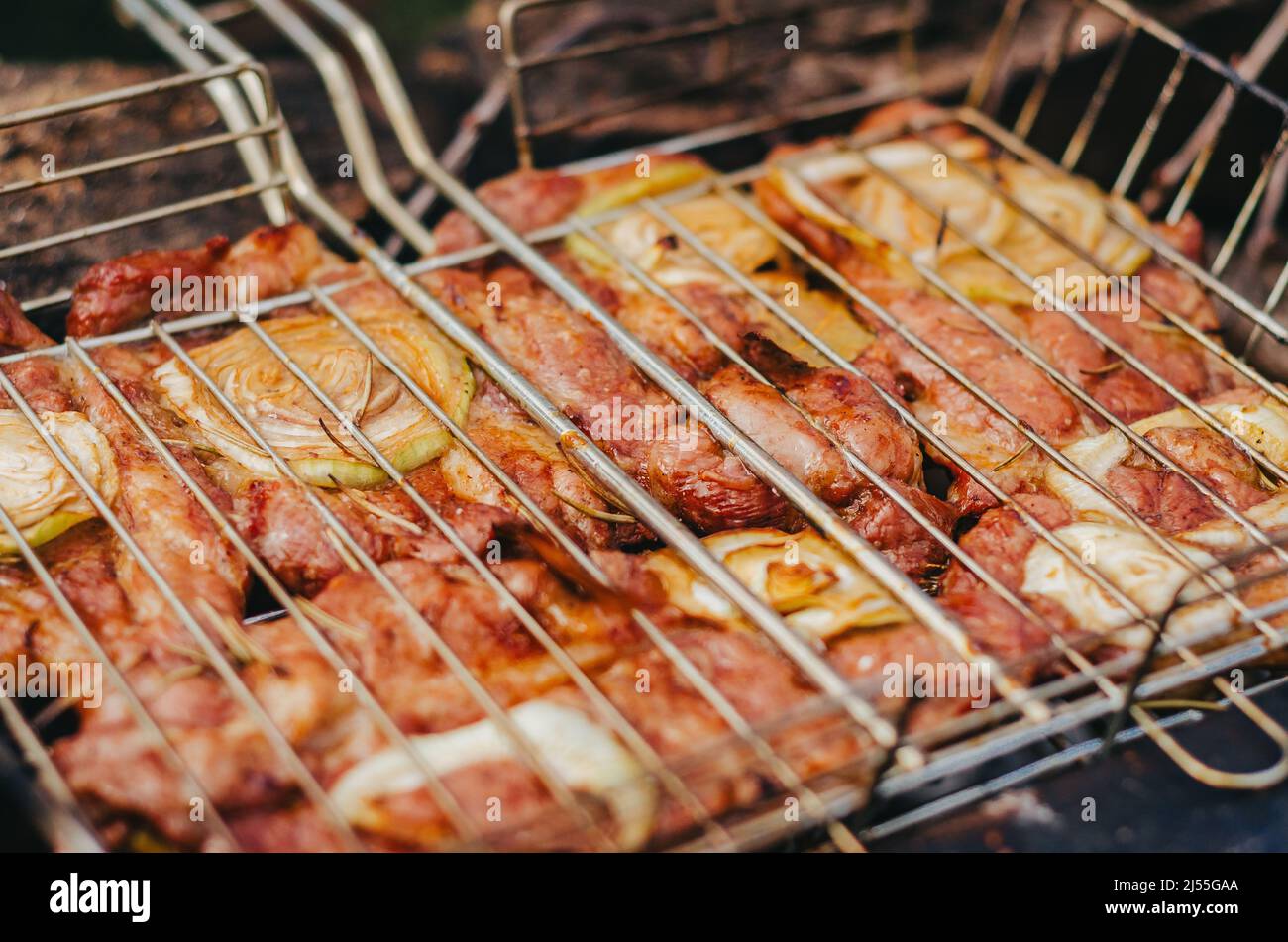 Top view on grill with meat. Cooking delicious food. Grilled meat with ...