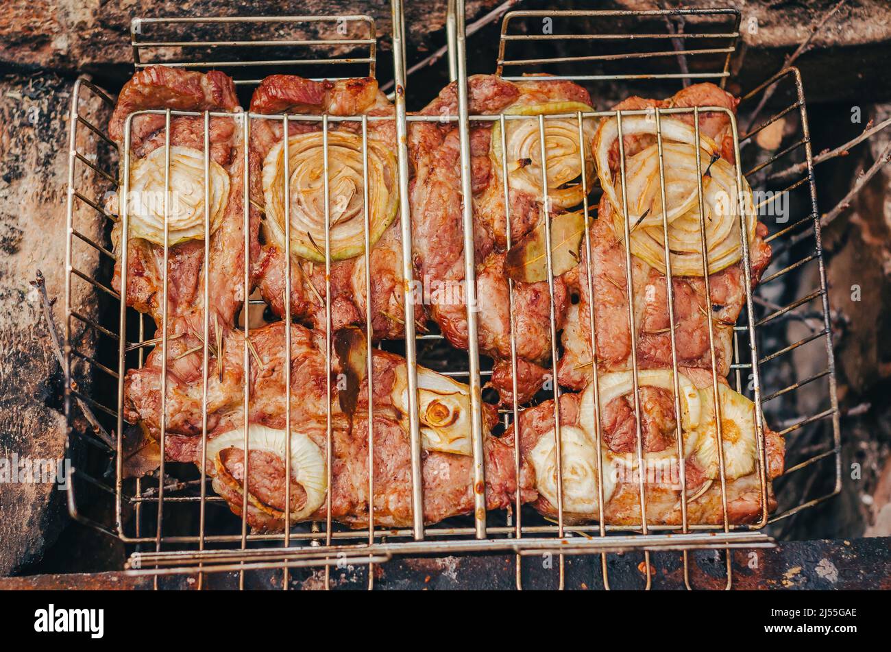 Top view on grill with meat. Cooking delicious food. Grilled meat with ...