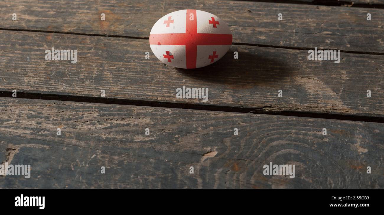 Flag of Georgia on a painted egg on a wooden board. Easter in Georgia ...