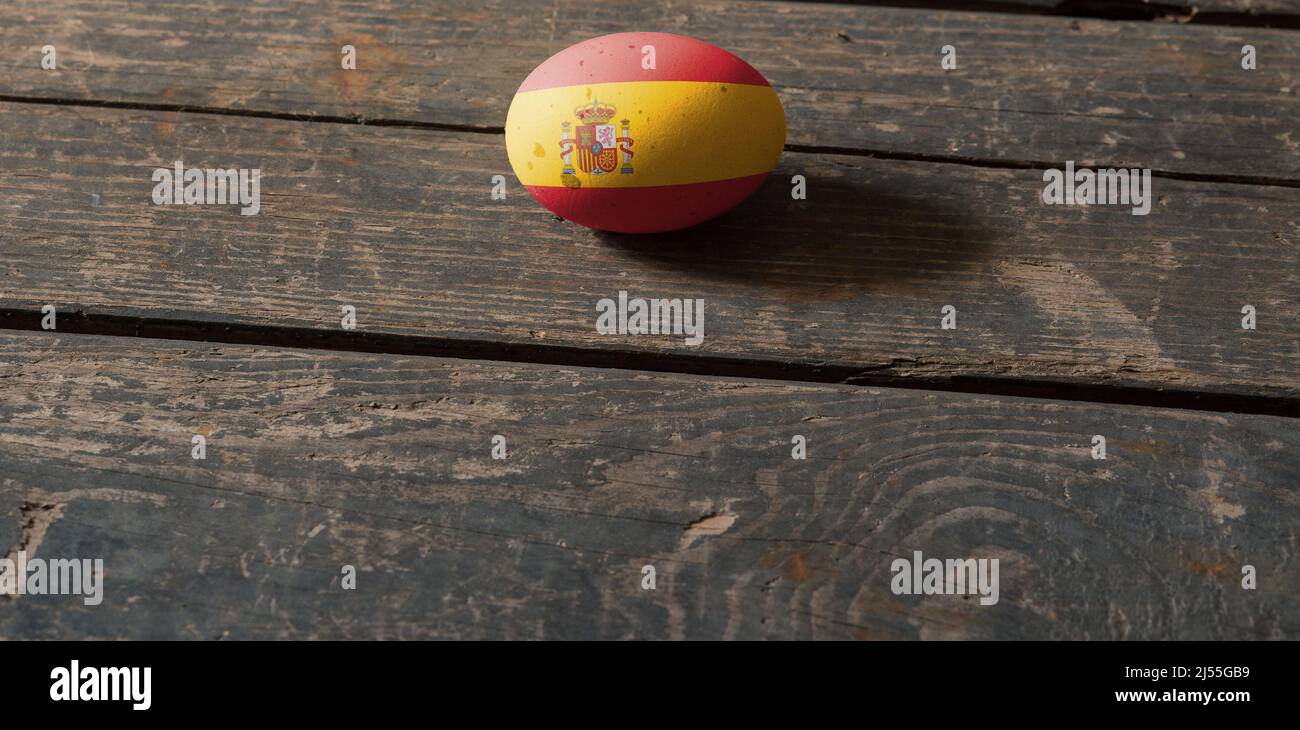 Flag of Spain on a painted egg on a wooden board. Easter in Spain ...