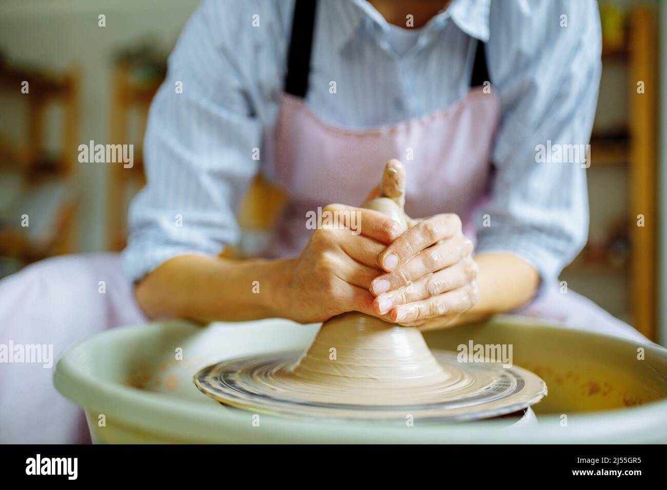 Potter hands sculpts a vase from clay on a Potter close up Stock Photo ...