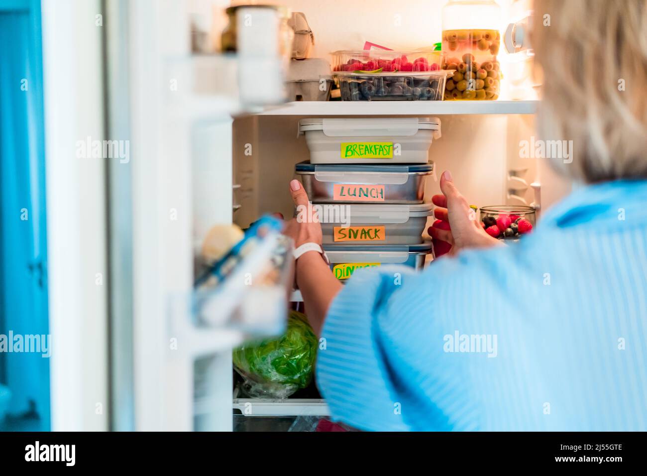 Healthy diet plan for weight loss, daily ready meal menu. Woman taking ...