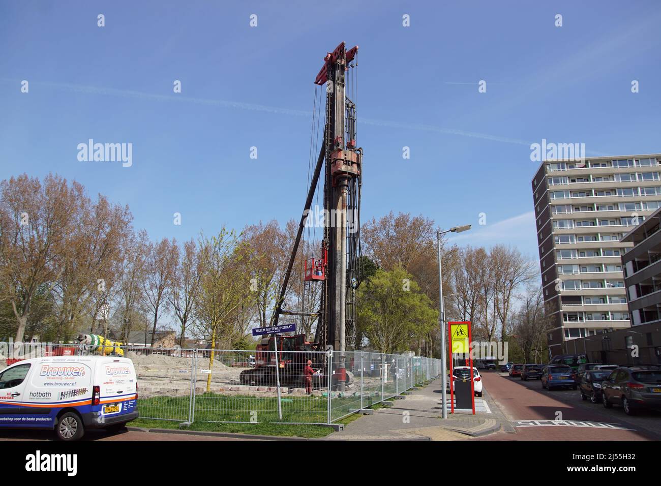 Building site. Machine with screw piles, foundation piles for the ...
