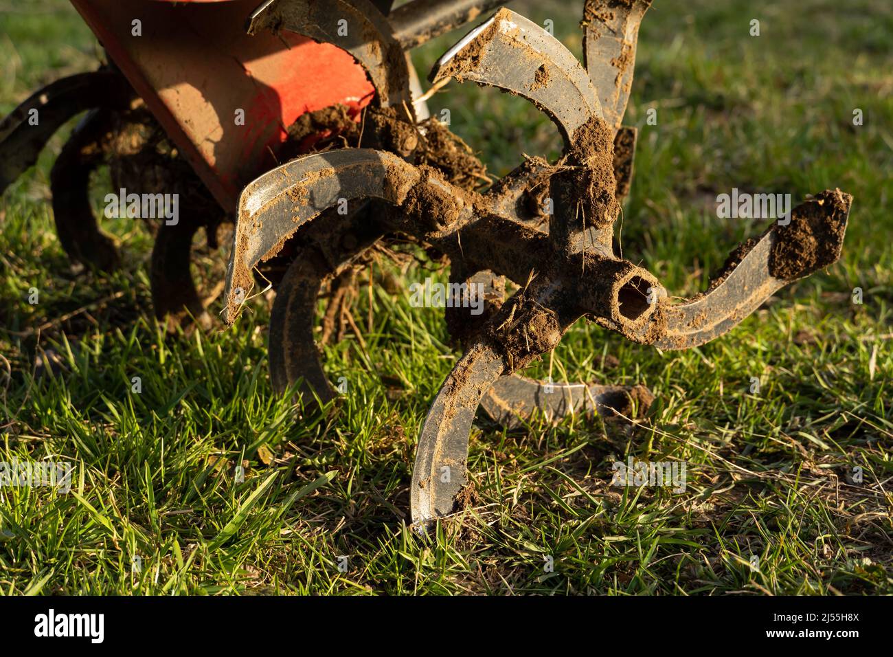 Dirty cultivator blades close-up. Tilling the land on the farm. Farming ...