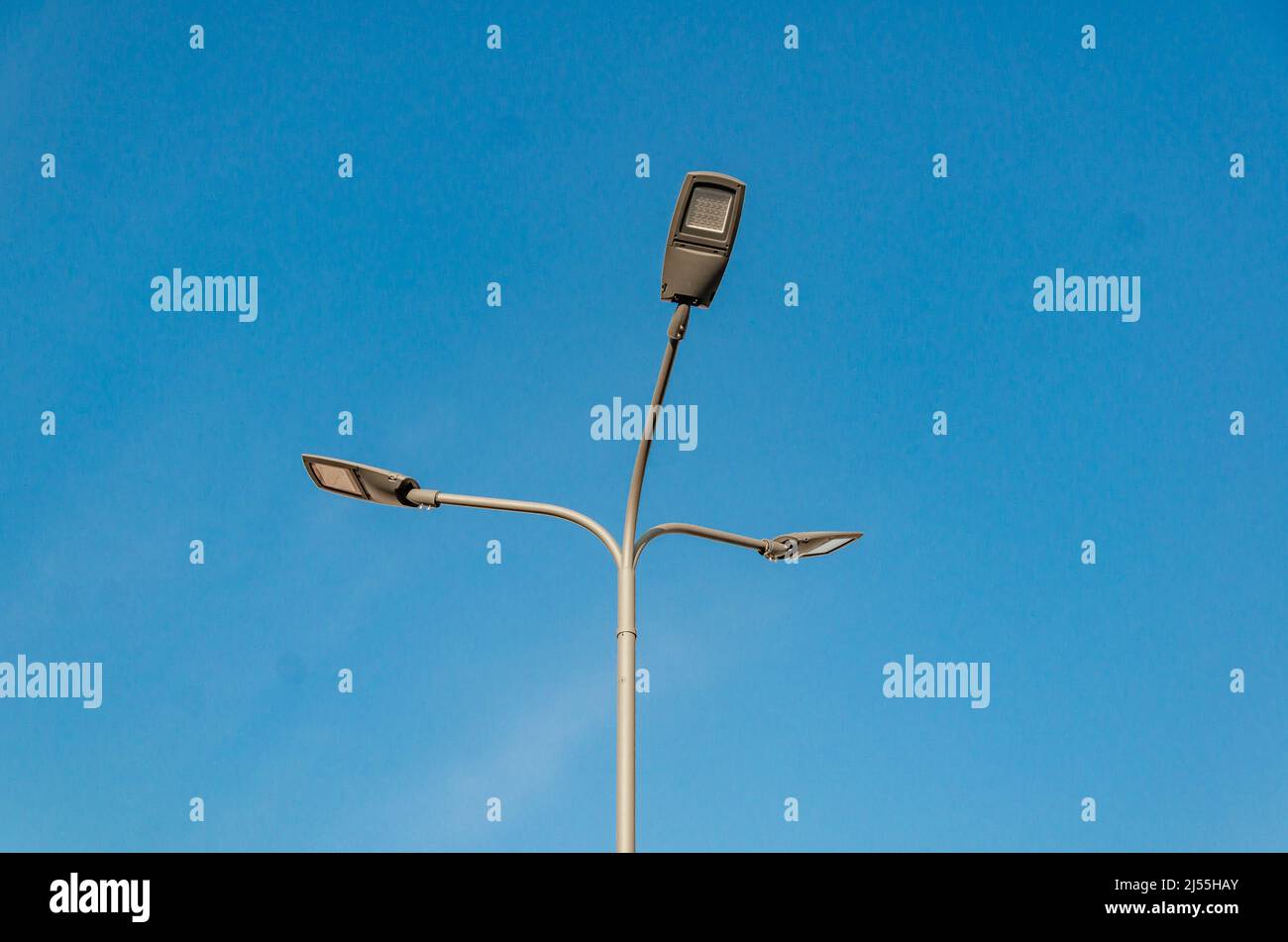 Modern street lighting. Lantern with three LED lamps Stock Photo - Alamy